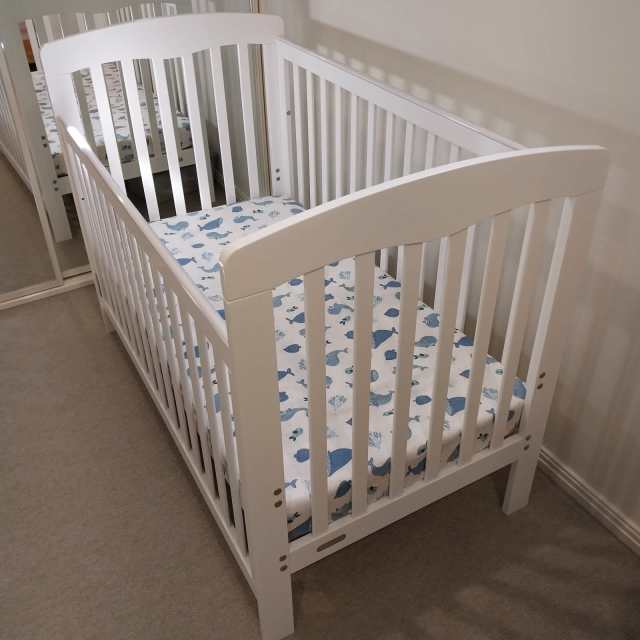 Timber cot with an adjustable base and Drop side and teething rails ...