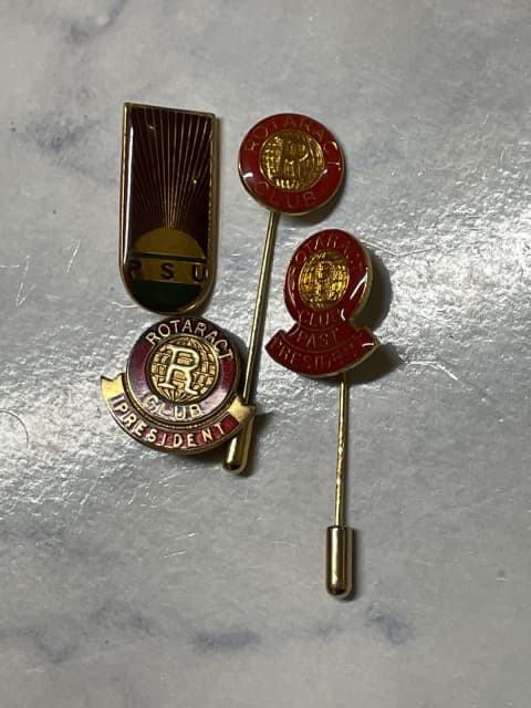 4 vintage metal badges 3 different rotaract and one PSU suit collector ...
