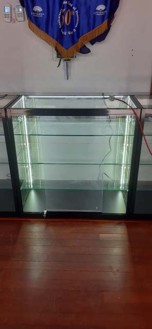 Discover the Elegance of Titanium Alloy Glass Counter with LED Lights ...