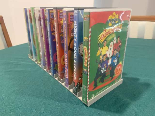 10 kids DVDs including *The Wiggles* PLUS a DVD rack. ALL for only $15 ...