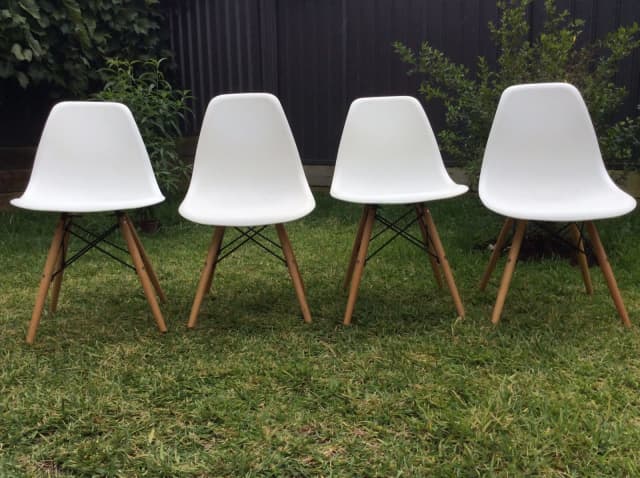 Set of 4 white dining chairs with solid timber legs /wire underneath ...