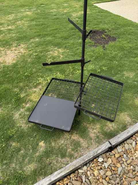 Camping BBQ with swinging hotplate and grill with centre steel pole ...