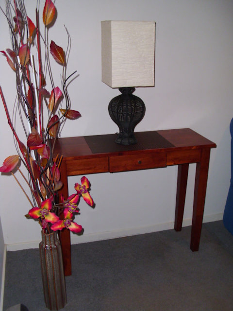 Console side table for bedroom or sitting room with lamp & flowers ...
