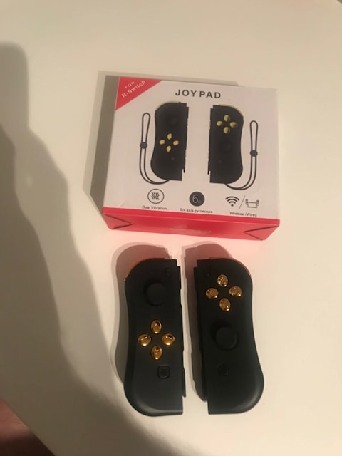 Two Nintendo Switch black and gold Joy-Con Wireless Controllers ...