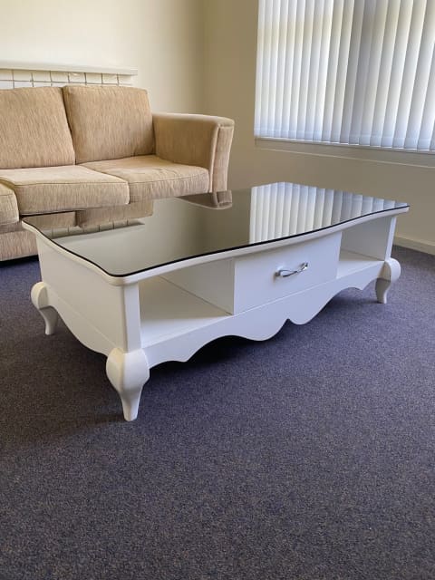 Coffee table glossy white and black glass top in good condition ...