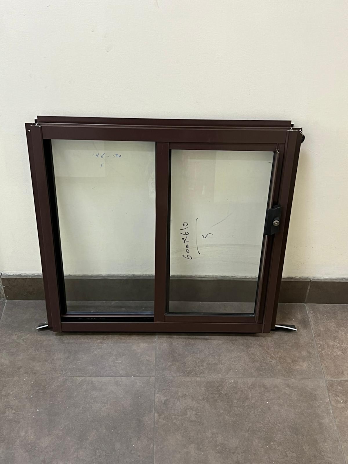 600Hx610W brown aluminium sliding window. Wetherill Park - Building ...