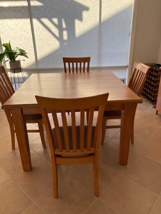 Solid timber table with four matching chairs